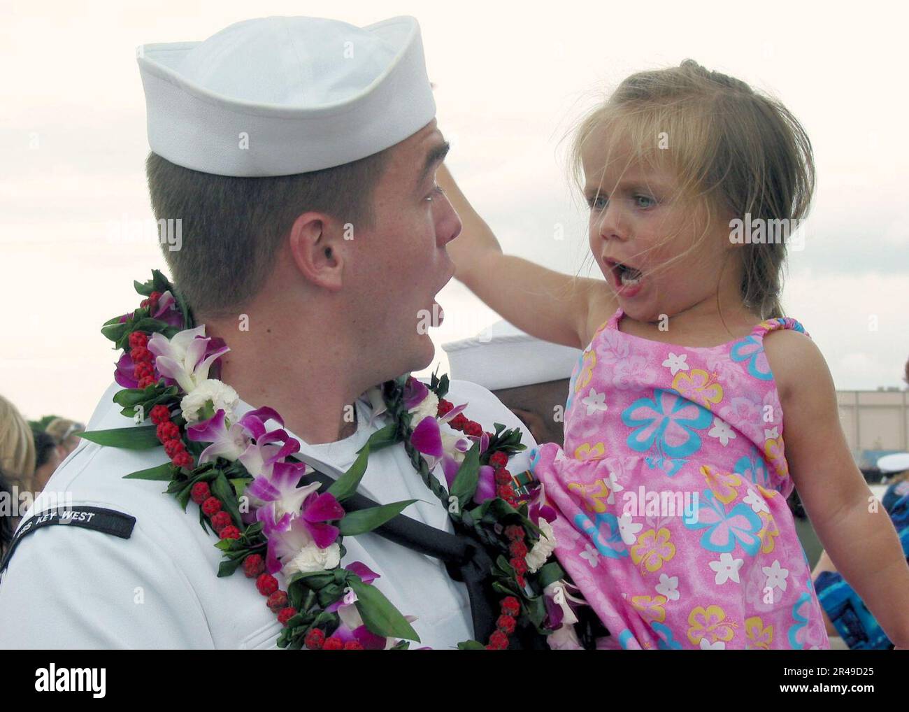 US Navy Yeoman 1st Class is greeted by his two-year-old daughter upon ...
