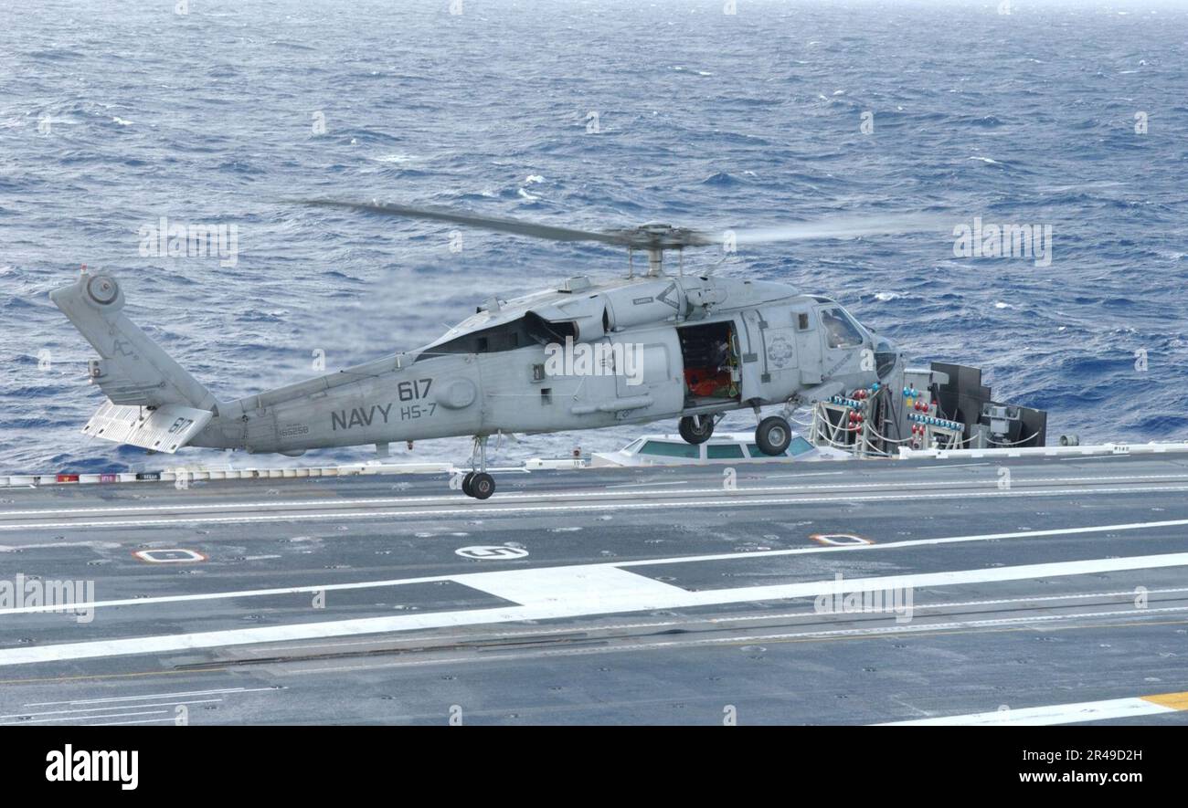 US Navy An SH-60F from Helicopter Anti-Submarine Squadron Seven (HS-7) lifts off the flight deck ...