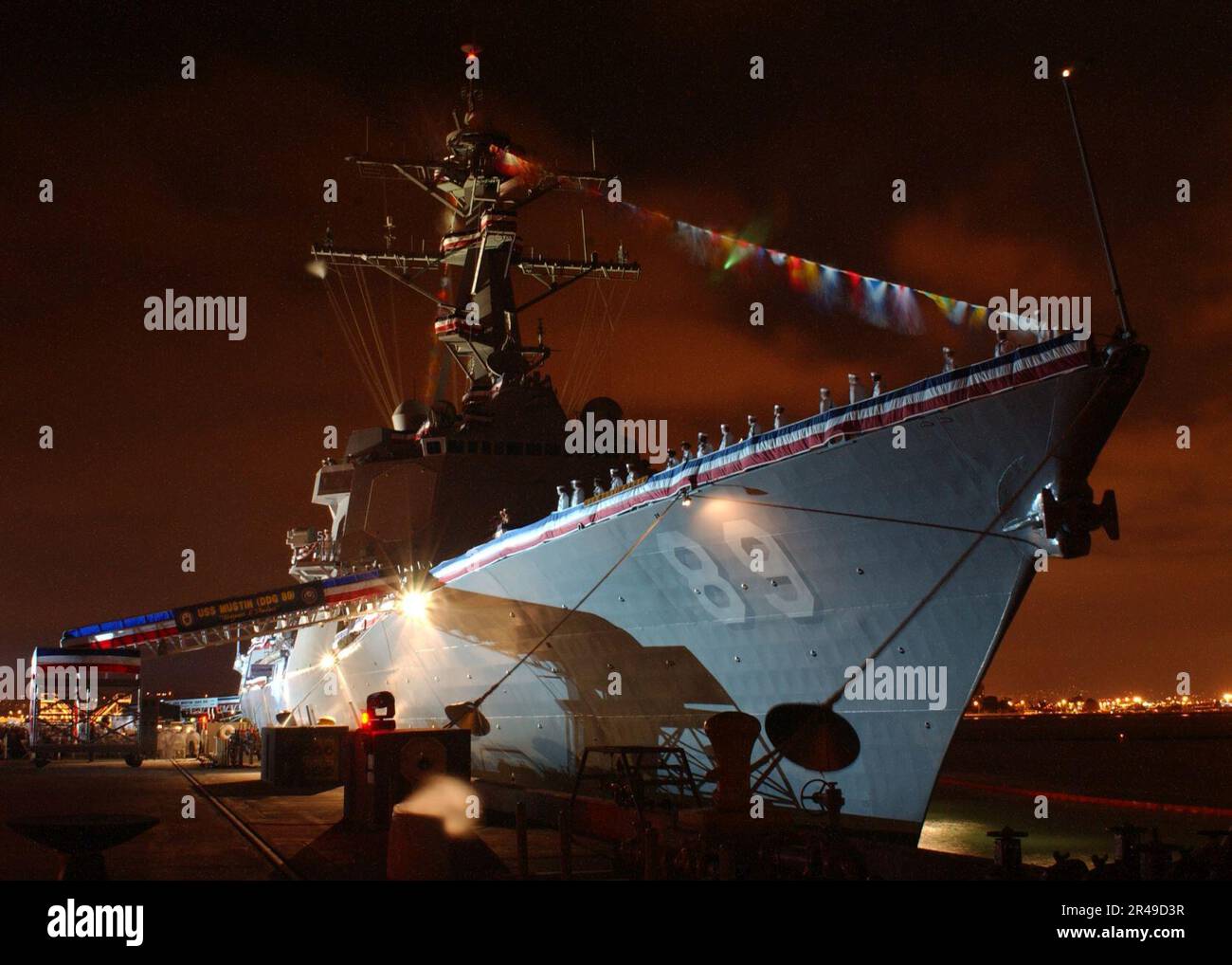 US Navy Sailors man the rails of USS Mustin (DDG 89), as the Navy's ...