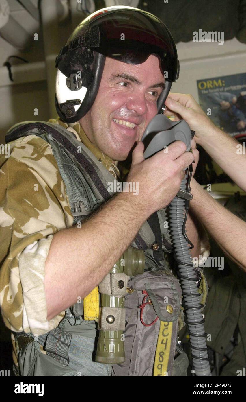 US Navy British Royal Navy Commodore Richard Leaman dons a flight suit ...