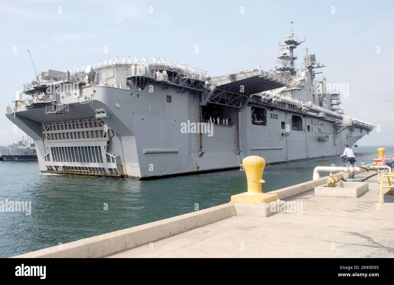 US Navy Sailors man the rails as USS Bonhomme Richard (LHD 6) returns ...