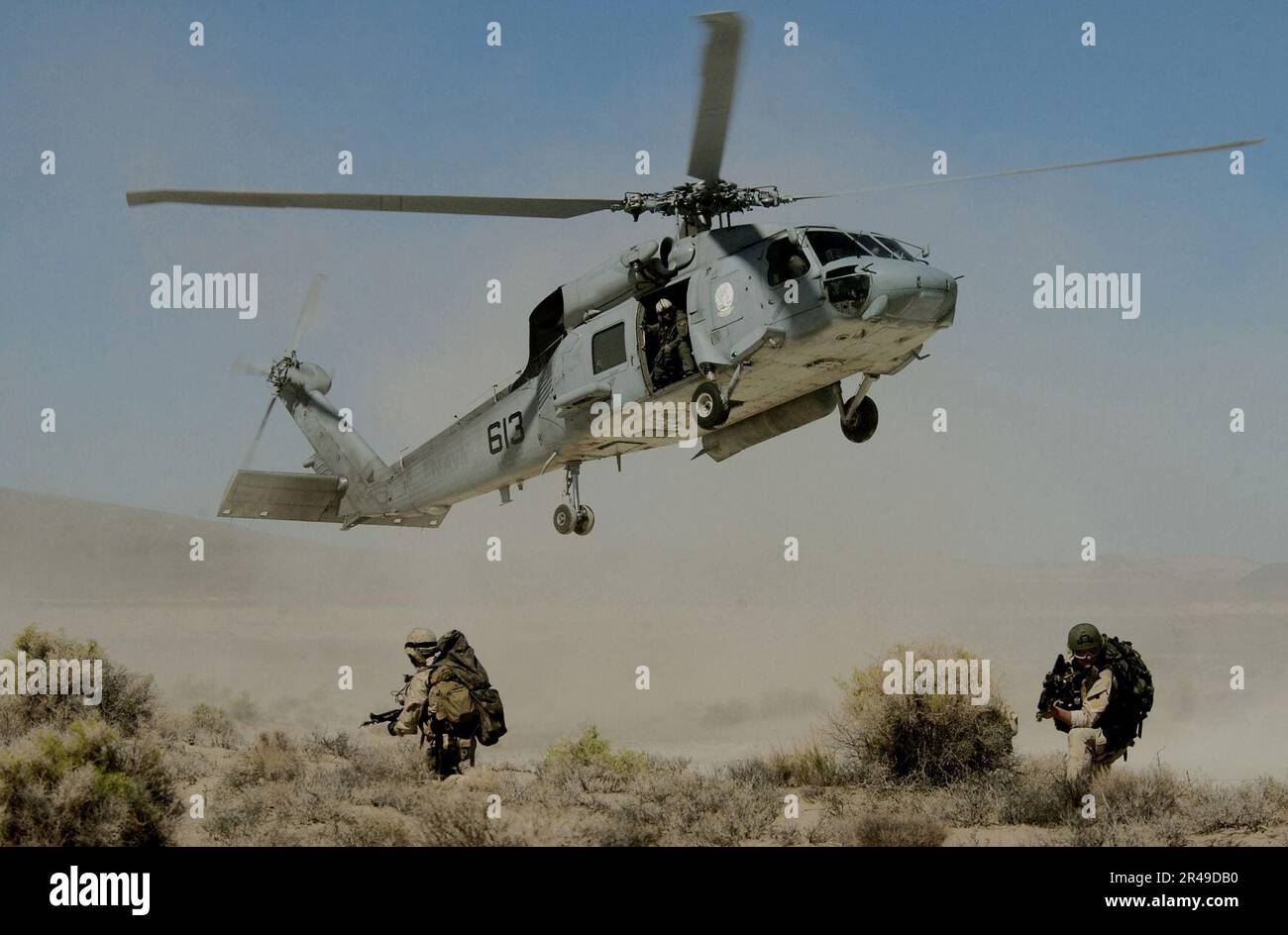 US Navy A HH-60H Seahawk helicopter departs after delivering Navy SEAL ...