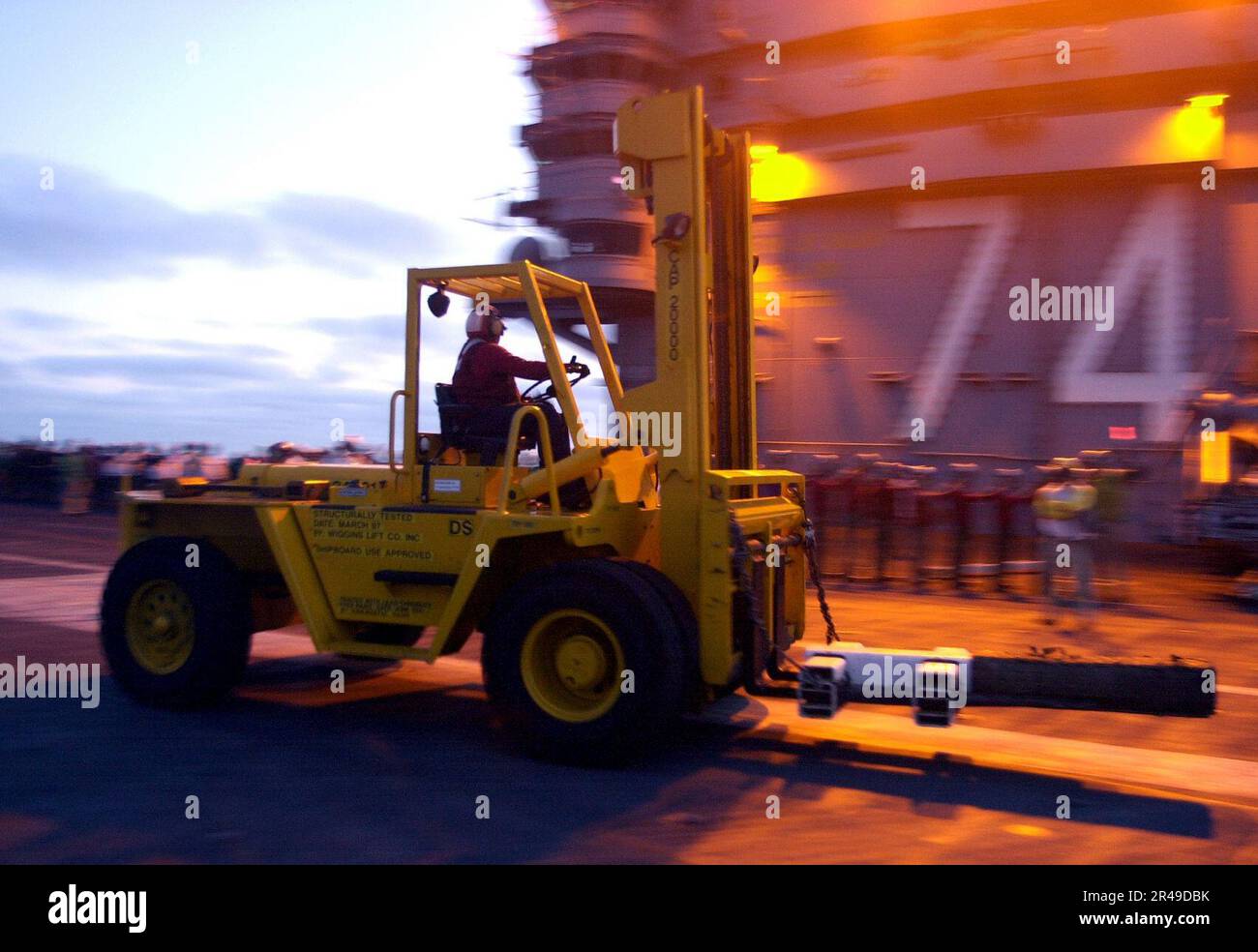 US Navy A sailor drives twenty-thousand pound forklift, known as the 20 ...