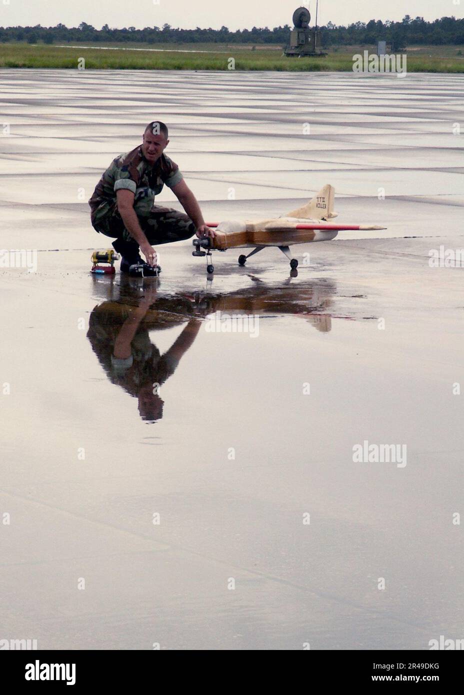 US Navy U.S. Marine Corps Staff Sgt. starts the engine of a remote ...