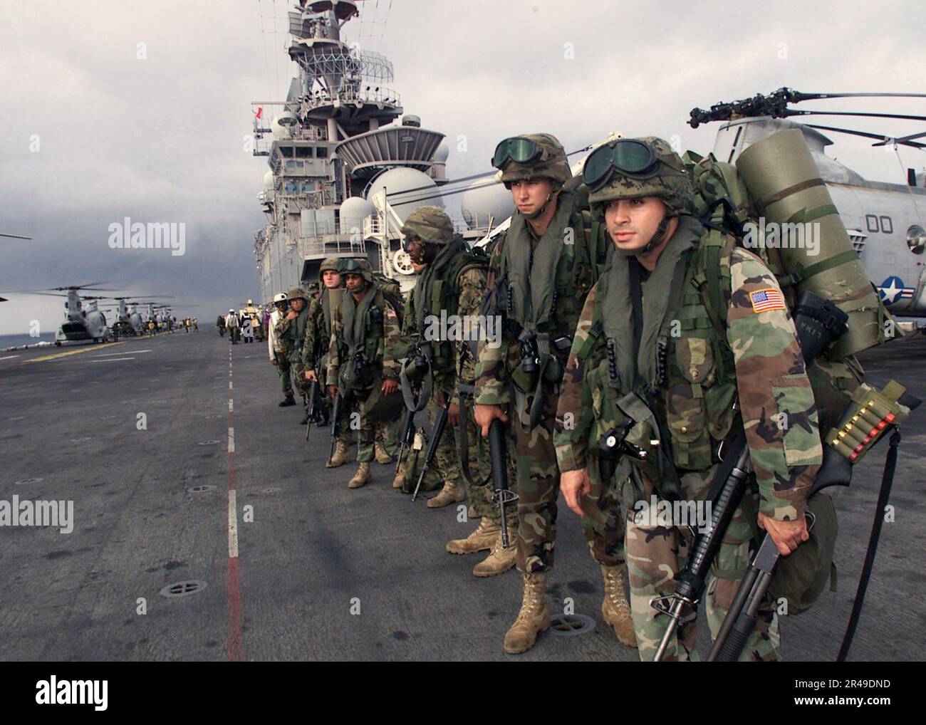 US Navy Marines from the 26th Marine Expeditionary Unit (MEU) wait on ...