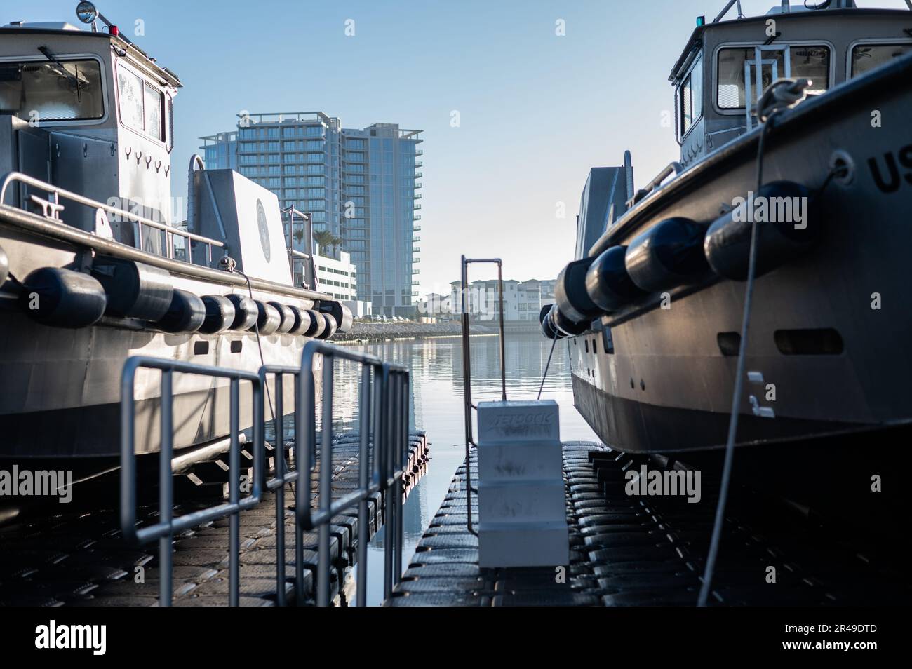 A U.S. Navy vessel docks in the water at Rattlesnake Point U.S. Army ...