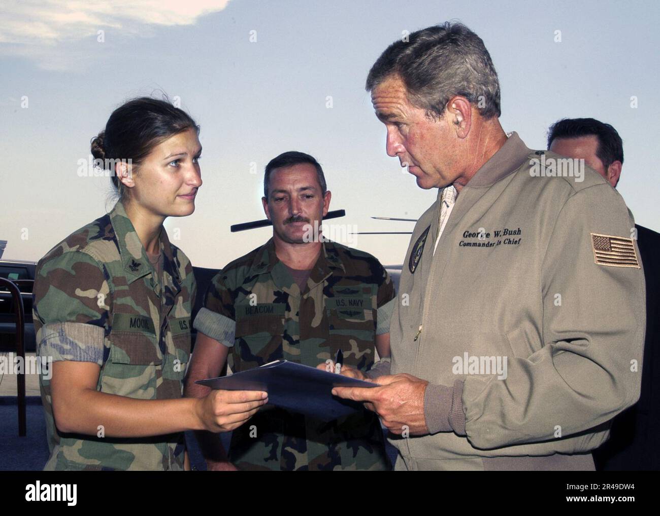 US Navy President George W. Bush signs a photograph for Photographer's ...