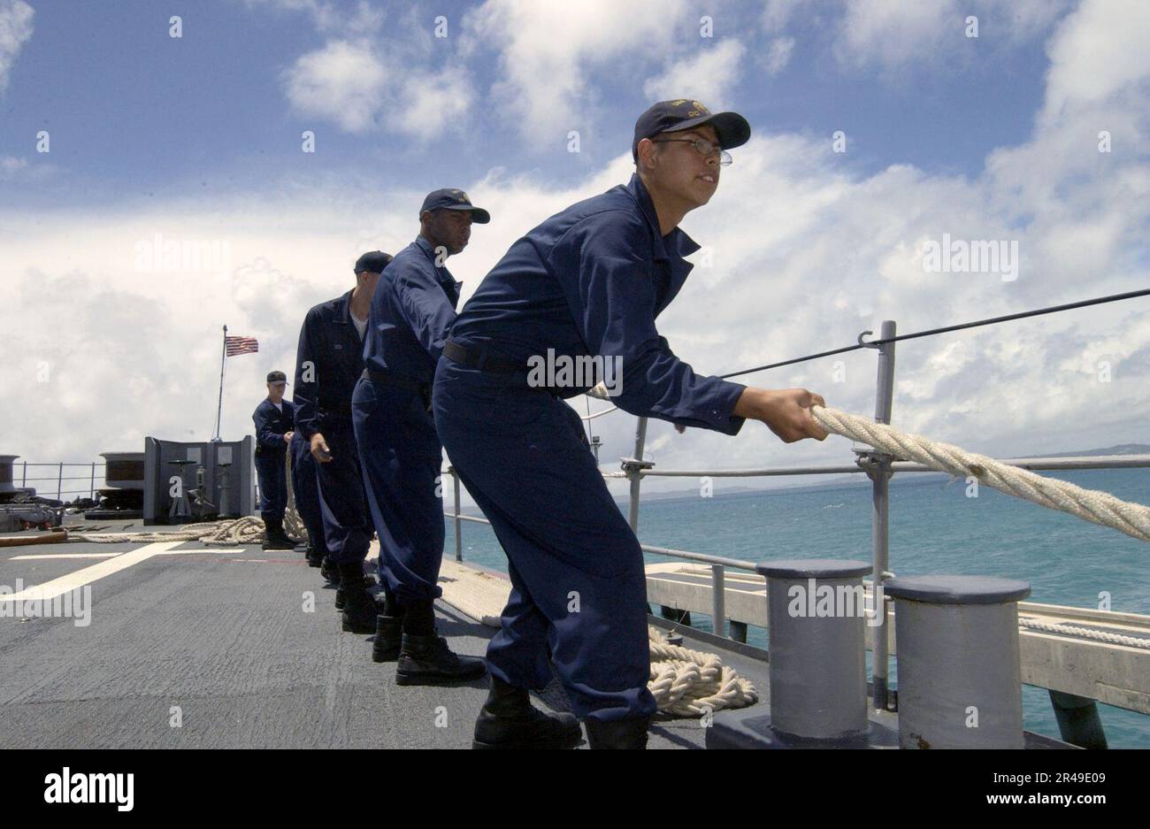 US Navy Sailors from USS Cushing's (DD 985) deck division hauls in the ...