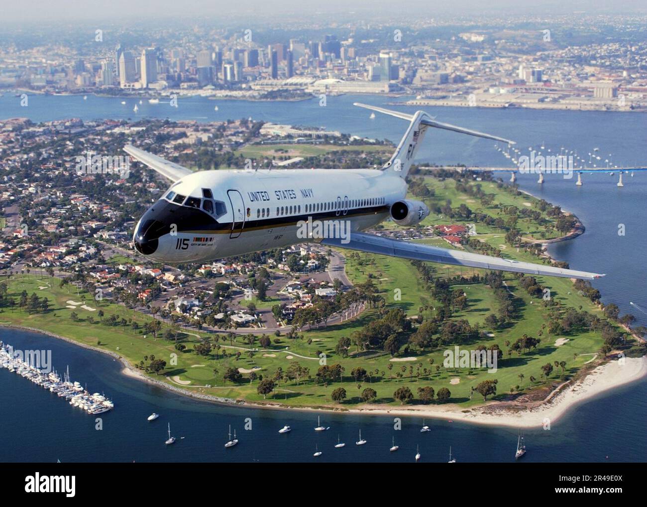 US Navy With the San Diego skyline in the background, a C-9B Skytrain ...