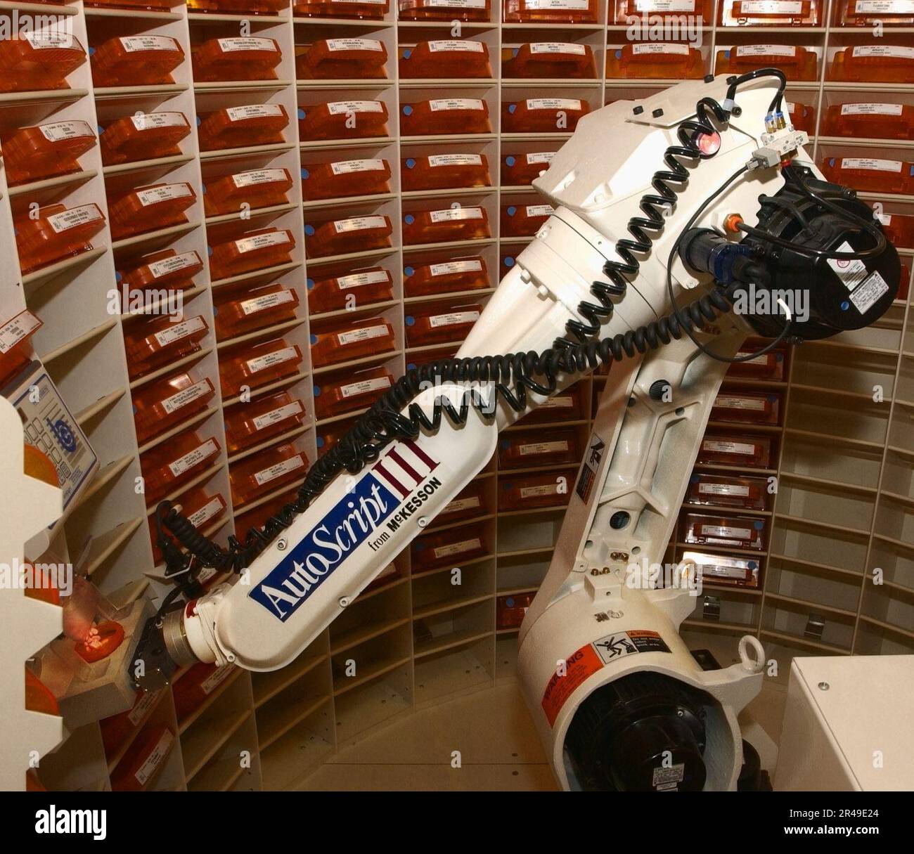 US Navy The Autoscript robot dispenses medication into a bottle at the ...