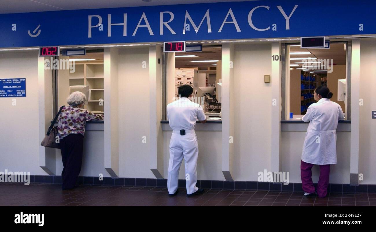 US Navy Patients and staff wait for medications at the pharmacy windows ...