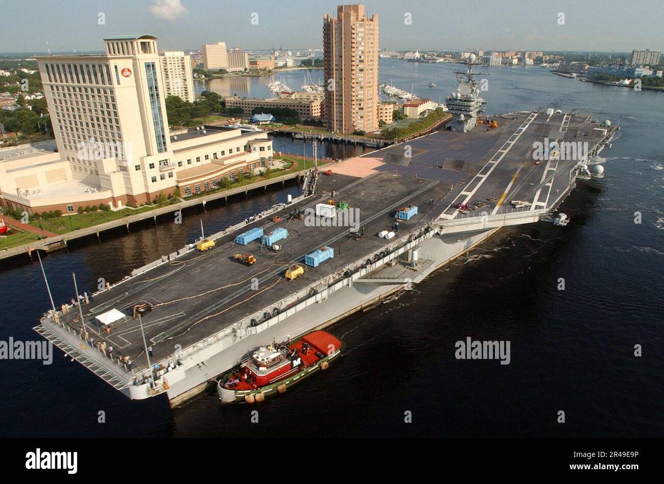 US Navy Tug boats guide USS Harry S. Truman (CVN 75) up the Elizabeth ...