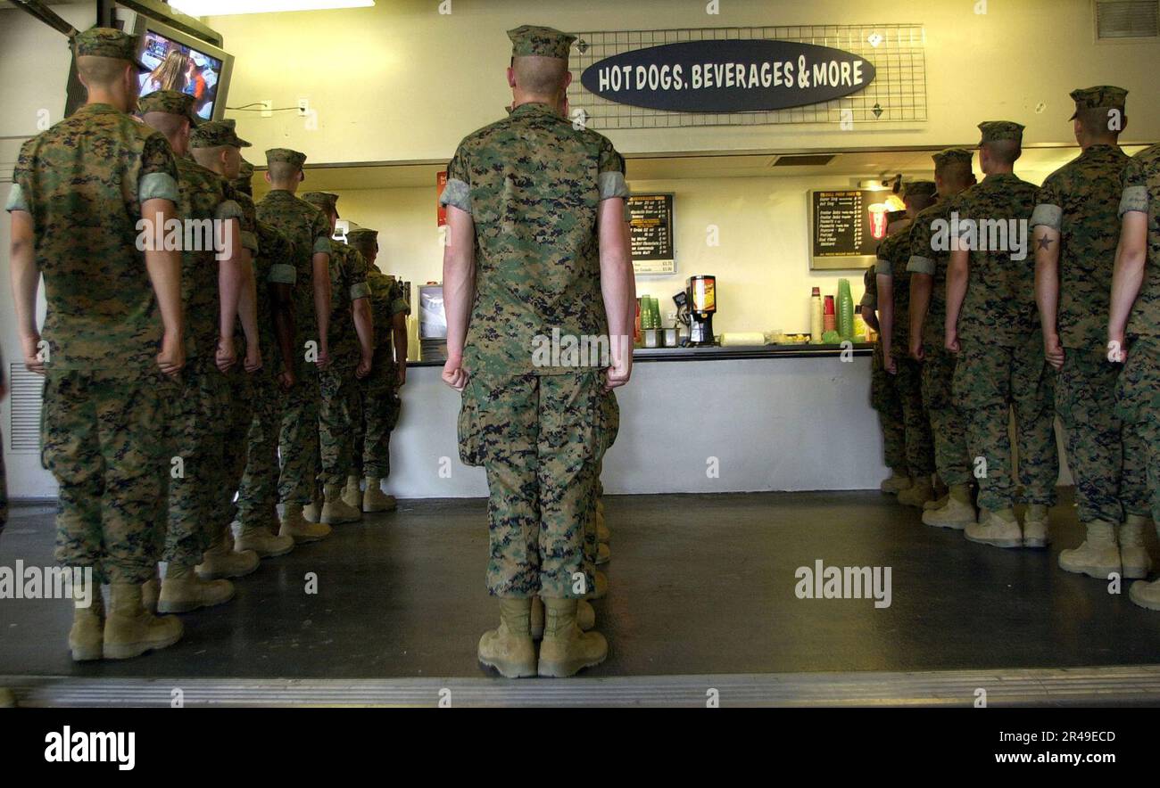 US Navy United States Marine Corps recruits stand in line to order ...