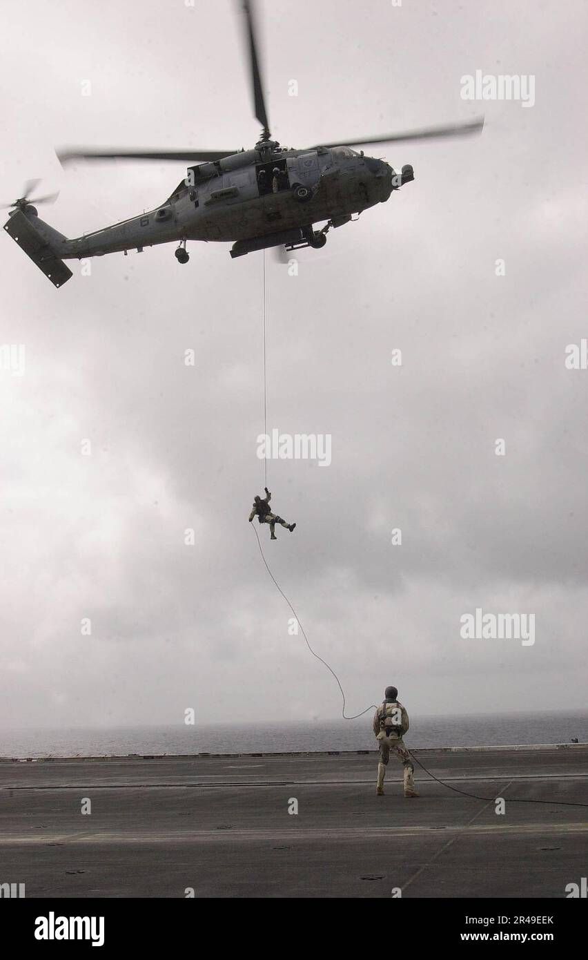 US Navy Personnel from the Explosive Ordnance Disposal Mobile Unit ...