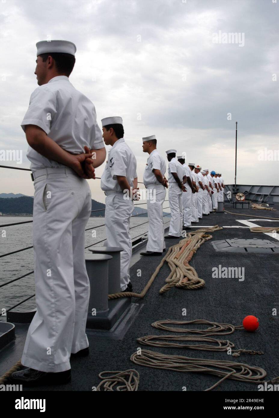 US Navy Sailors man the rails of the guided missile frigate as it pulls ...