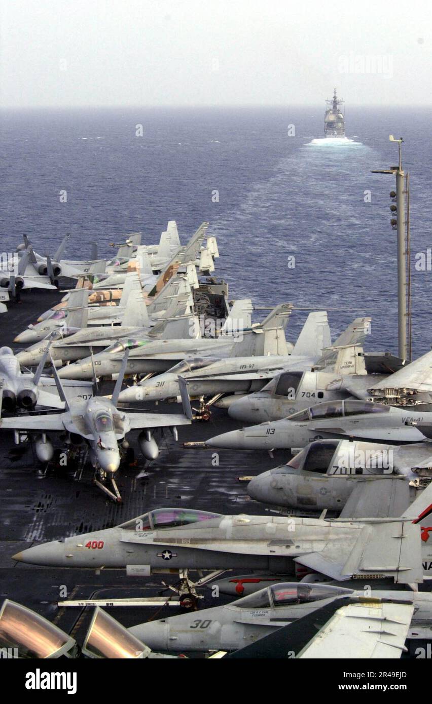 US Navy Various Navy aircraft are chocked and chained to the flight ...