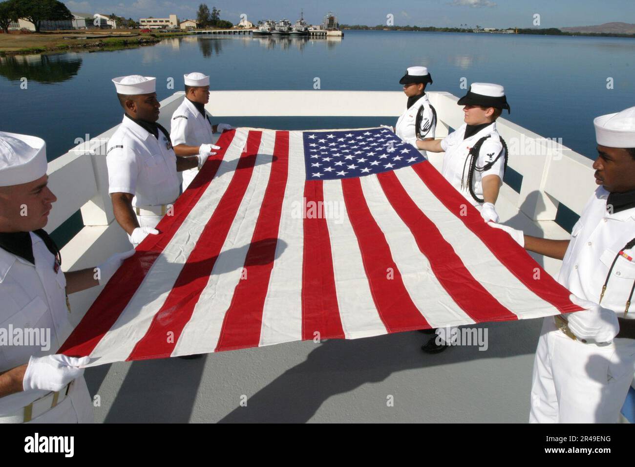 US Navy A Naval Station Pearl Harbor Ceremonial Guard folds the ...