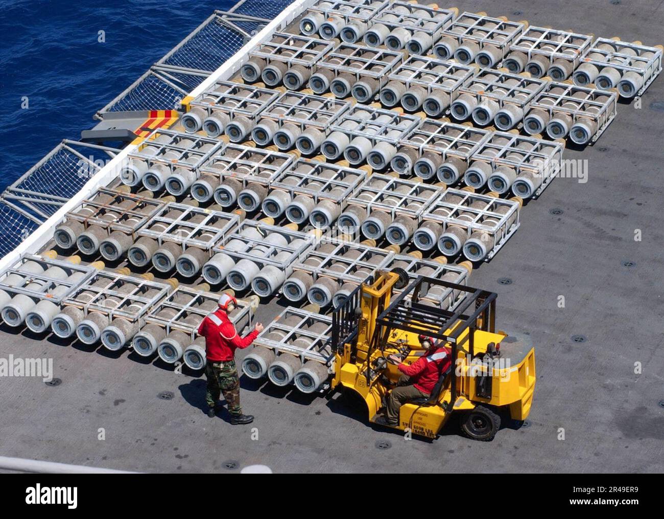 US Navy Staging 1000-pound Mark 83 general-purpose bombs on the flight ...