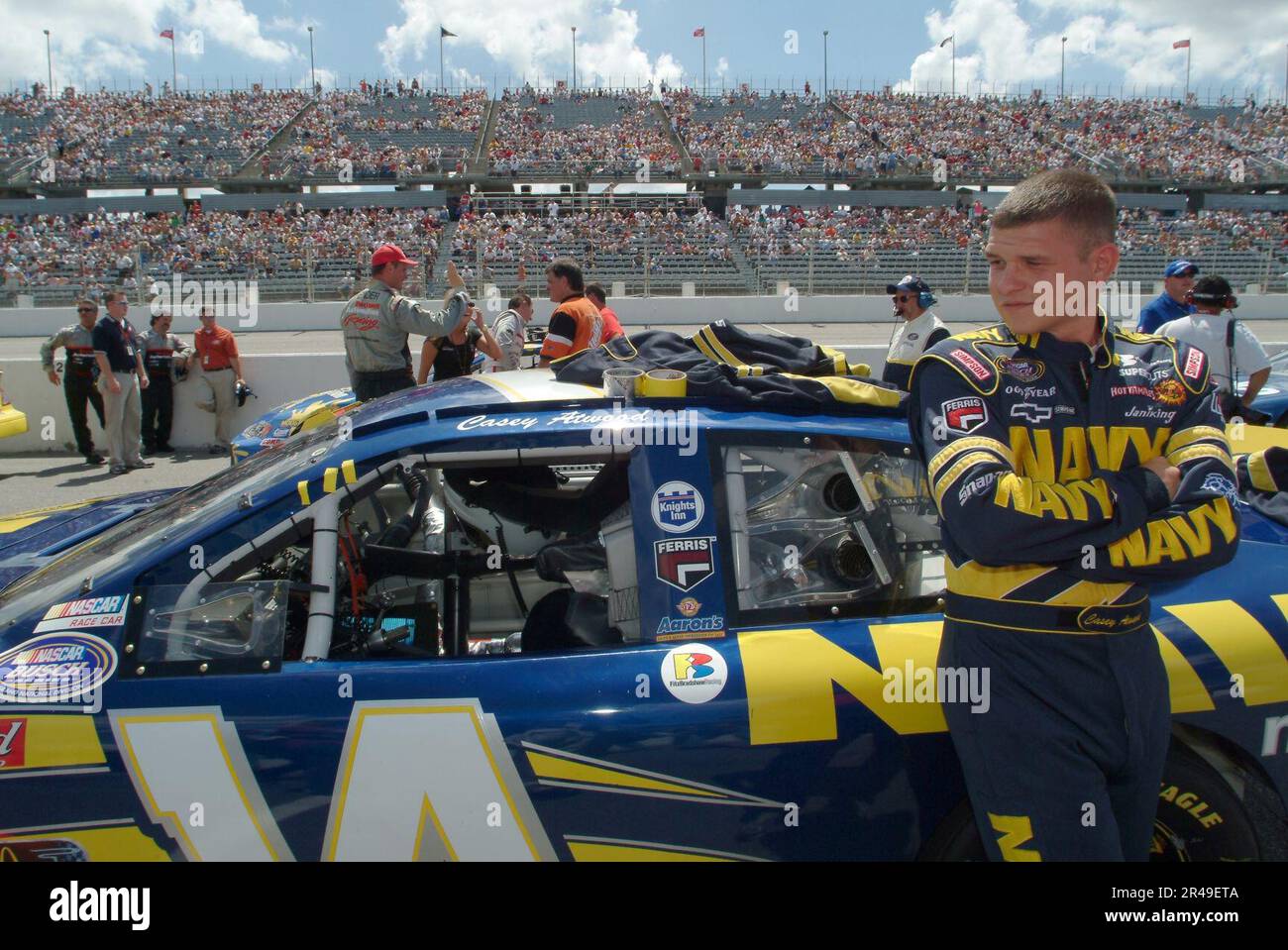 US Navy NASCAR Busch Series driver Casey Atwood stands next to the Navy ...