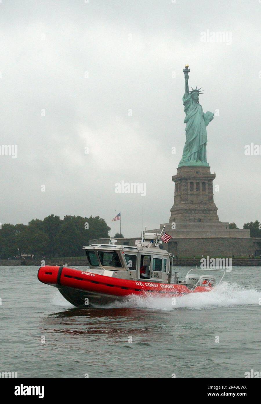 US Navy A U.S. Coast Guard boat patrols the in New York Harbor by the ...