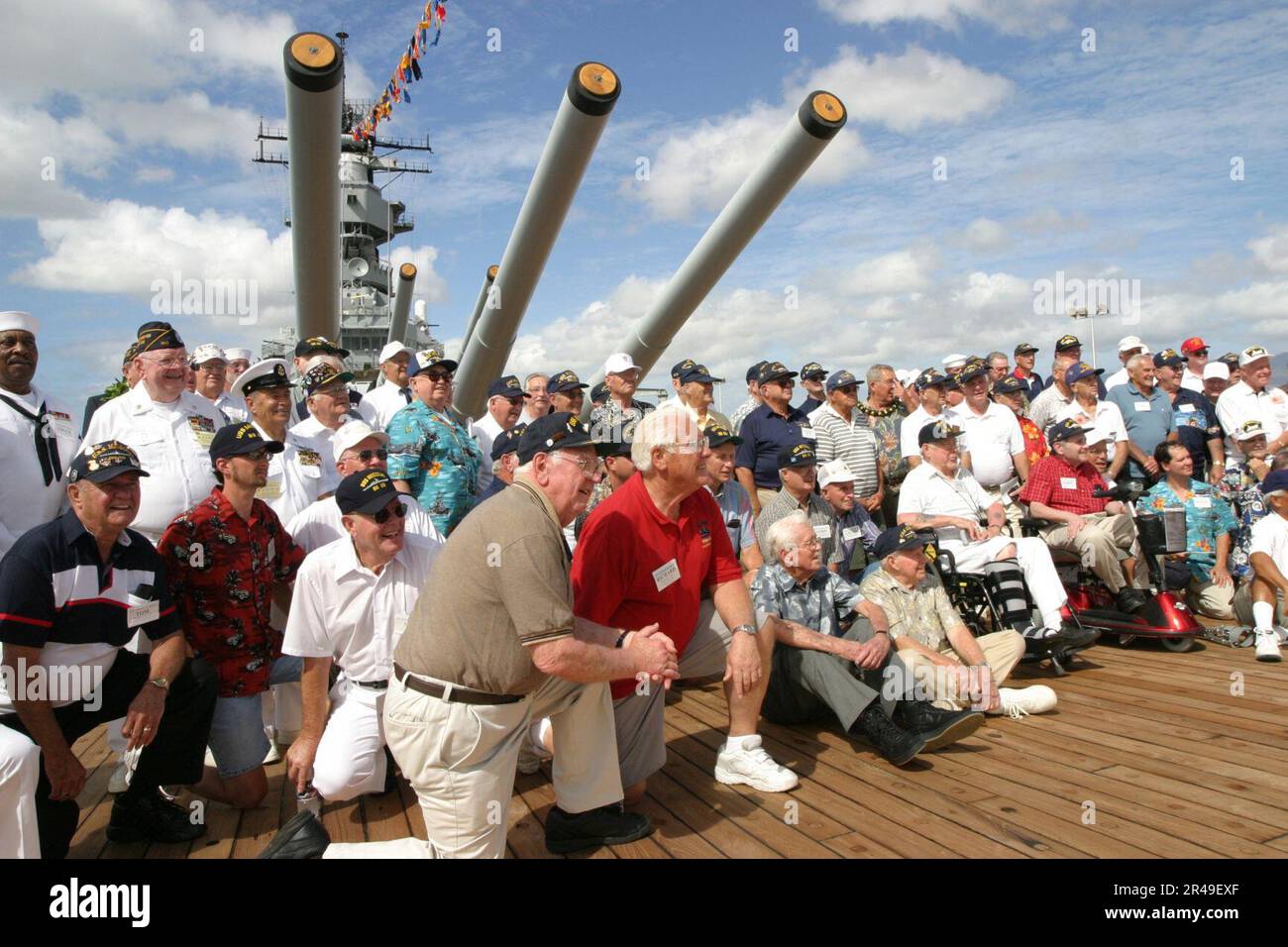 US Navy Former crewmembers of the Battleship Missouri (BB 63) pose for ...
