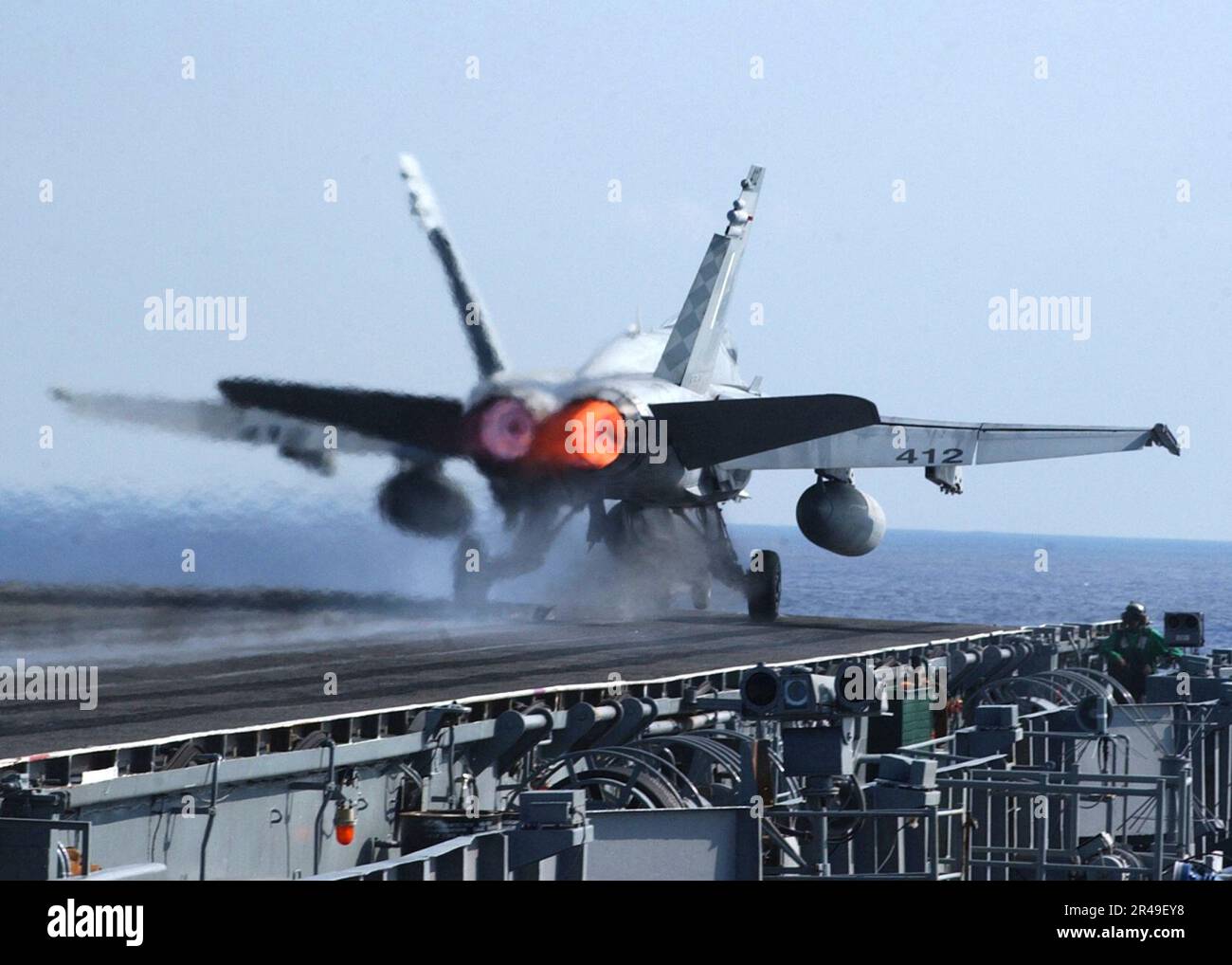 US Navy An F-A-18 Hornet launches from one of four steam powered ...