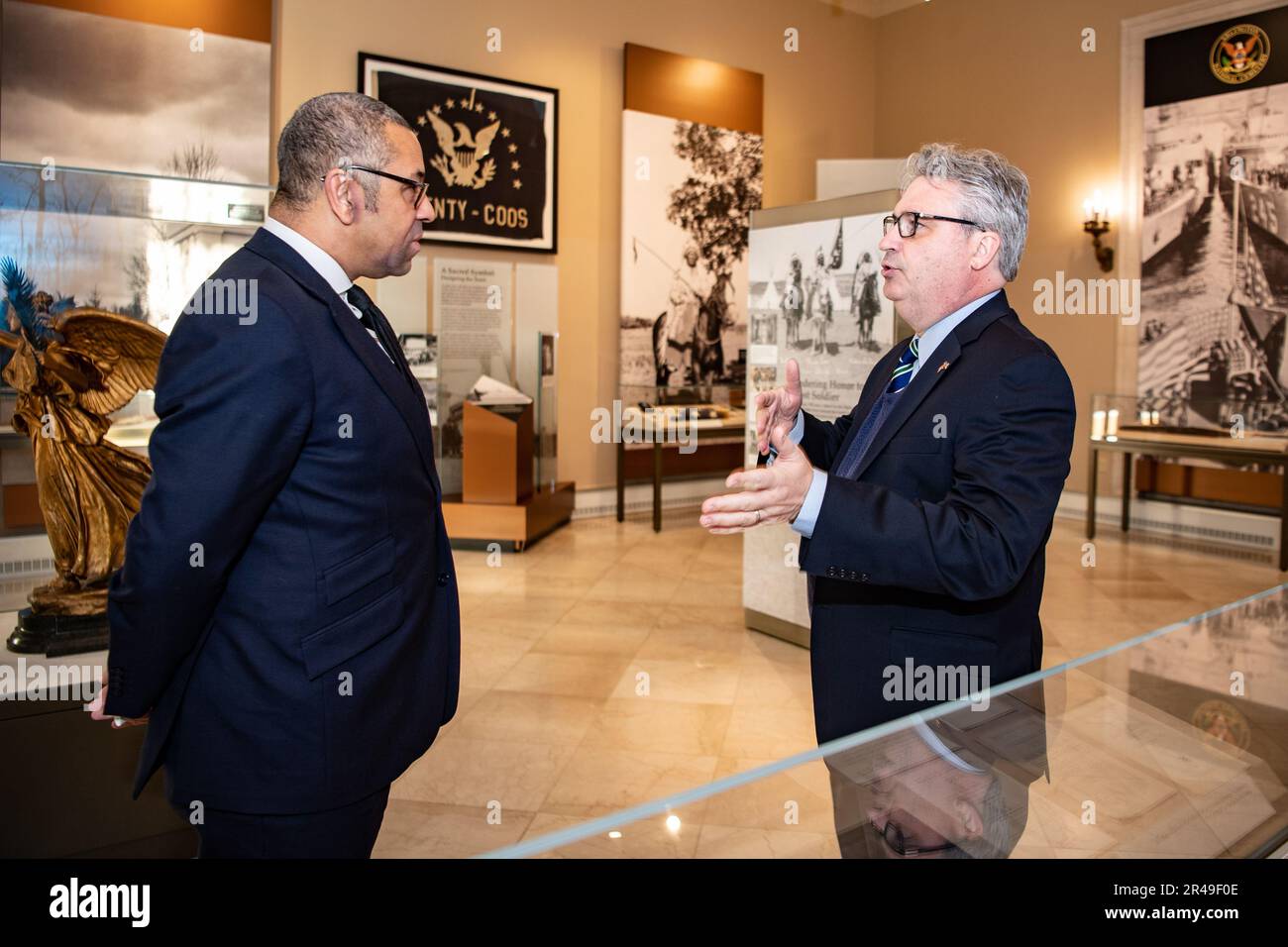 Rod Gainer (right), curator, Arlington National Cemetery, gives a tour ...