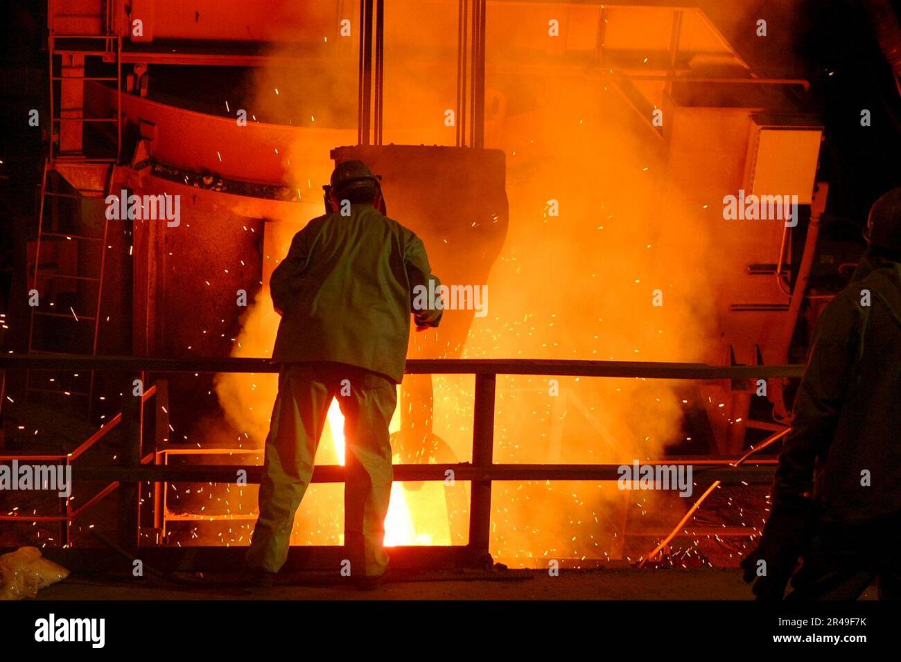 US Navy A worker from the Amite Foundry supervises the pouring of ...