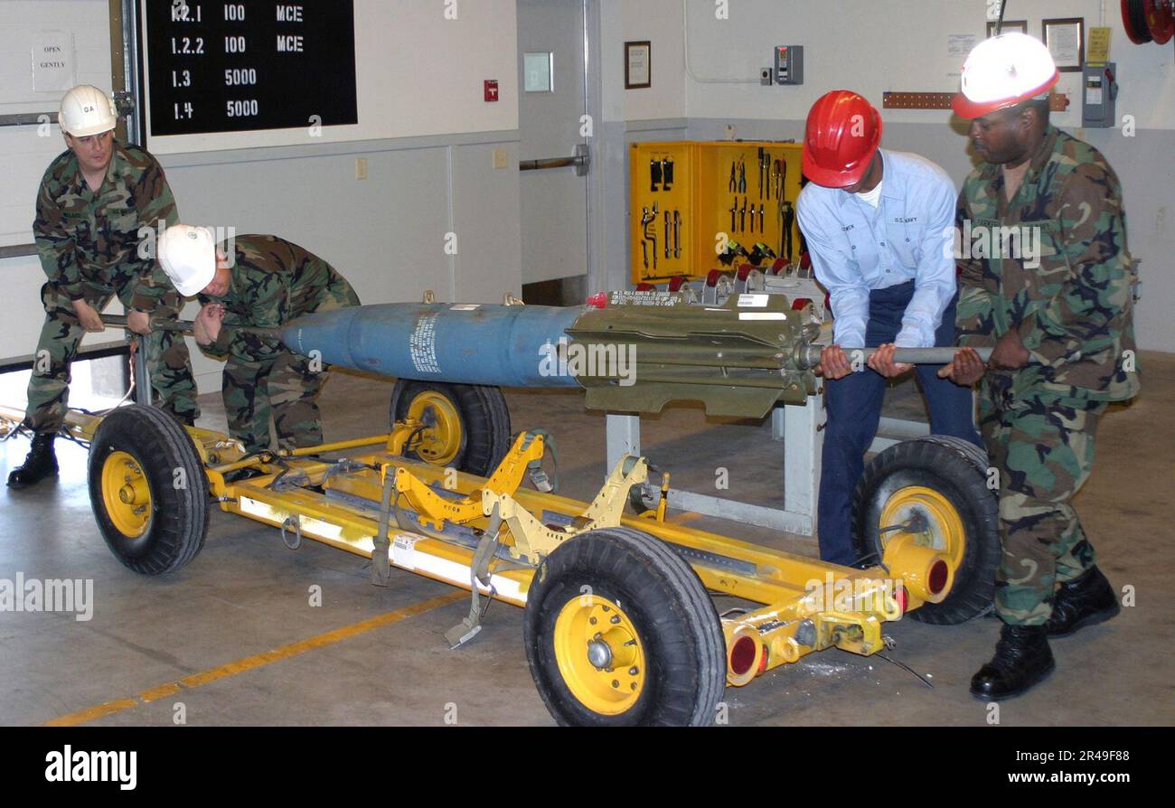 US Navy A team of Sailors place a recently assembled inert bomb on a ...