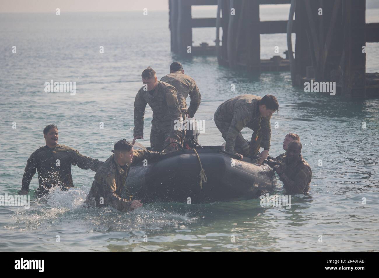 U.S. Army Soldiers with the 511th Engineer Dive Detachment jump out of ...