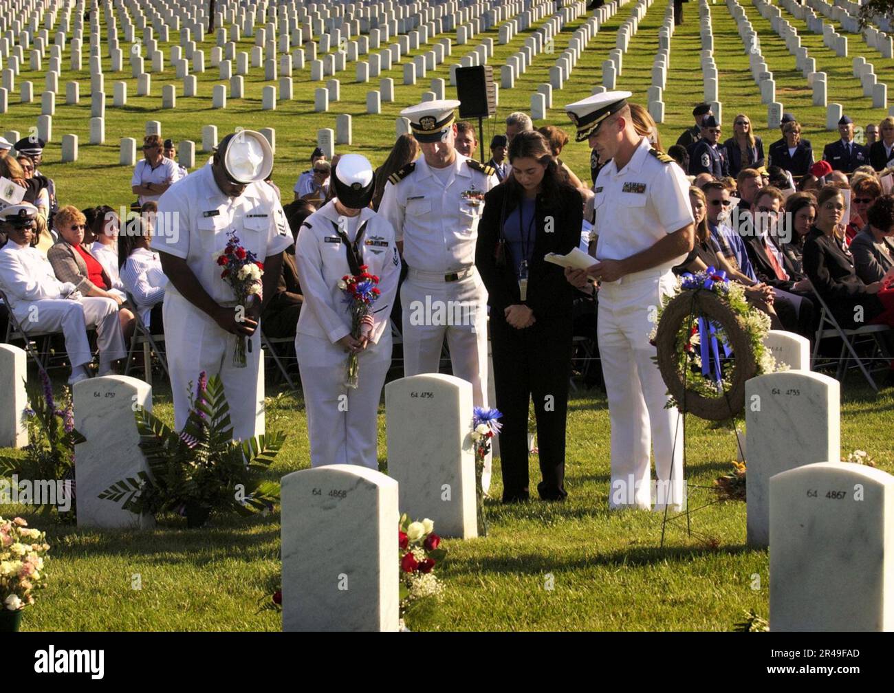 US Navy Navy personnel pause for a moment with a family member after ...
