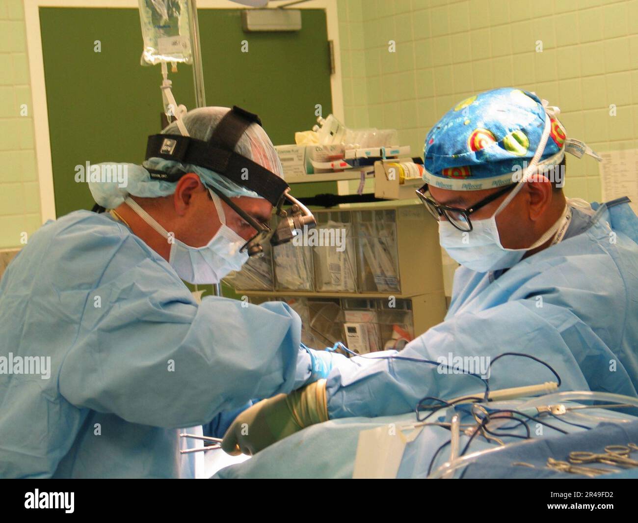 US Navy Surgeons, Cmdr. Miguel A. Cubano and Cmdr. Eliseo E. Bautista ...