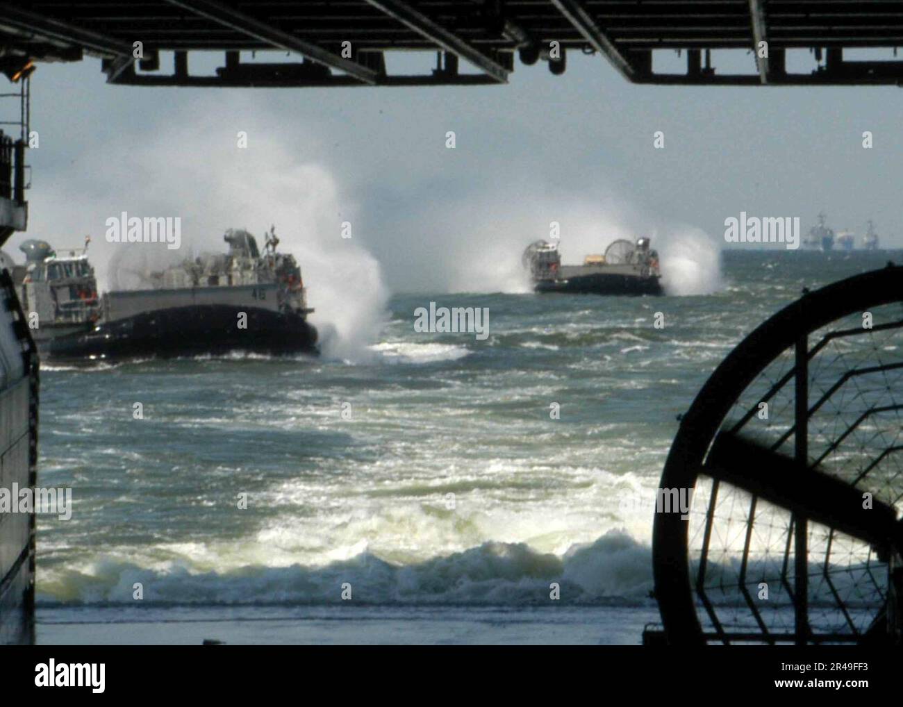US Navy Landing Craft Air Cushions approach the well deck Stock Photo ...
