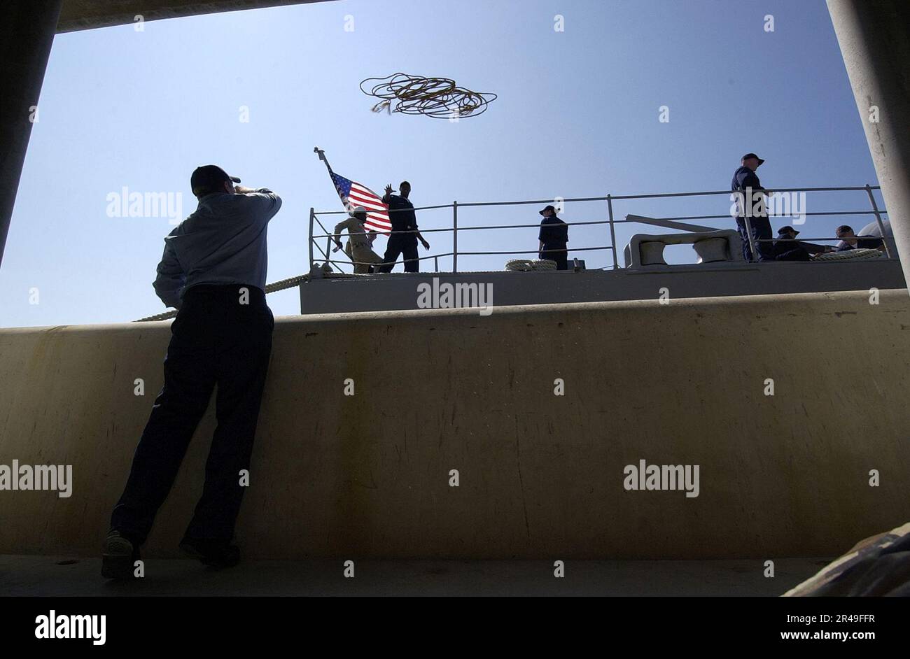 US Navy Sailors aboard USS Briscoe (DD 976) prepare the ship to ride ...