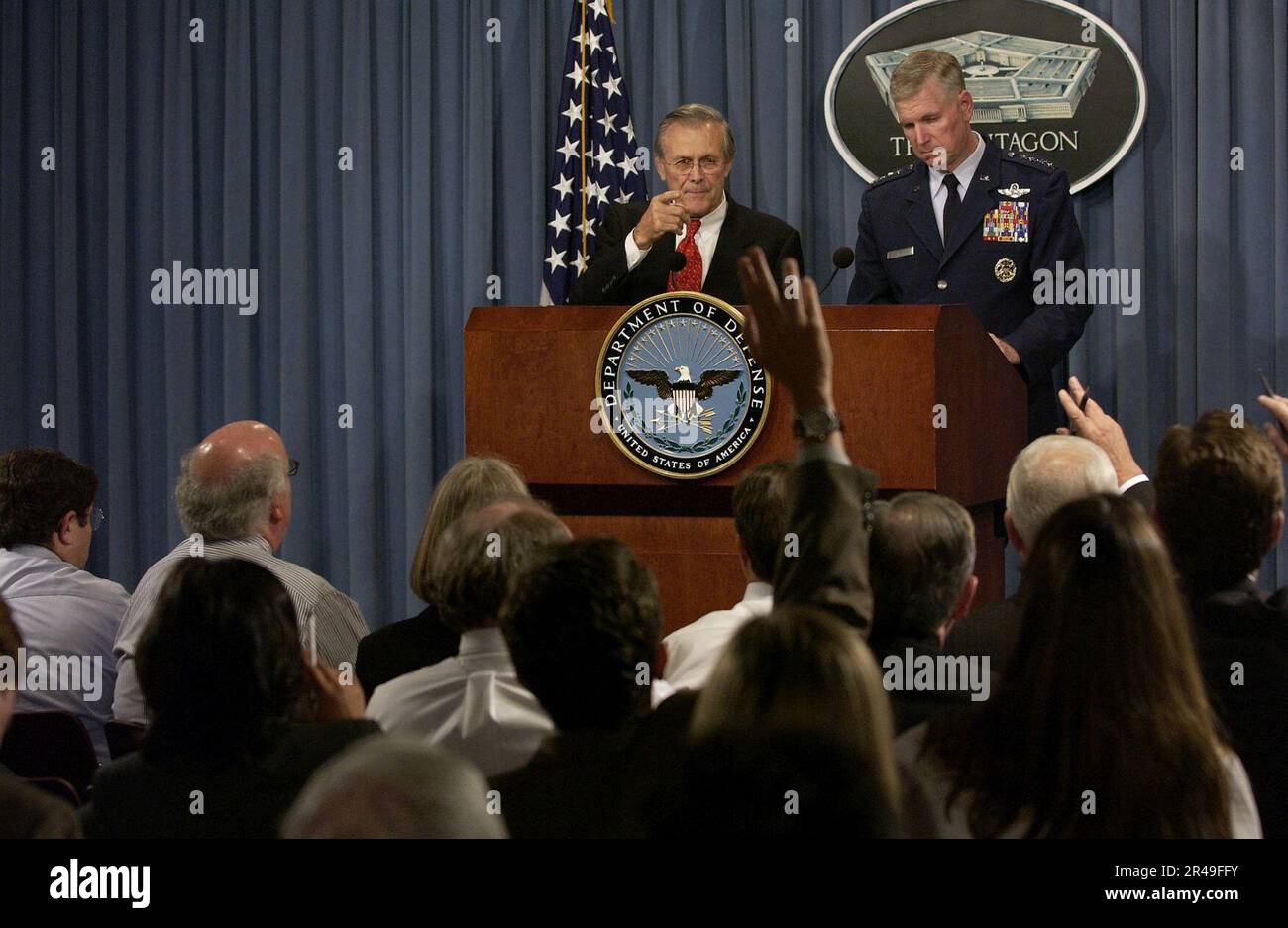 US Navy Secretary of Defense, Donald H. Rumsfeld responds to a reporter ...