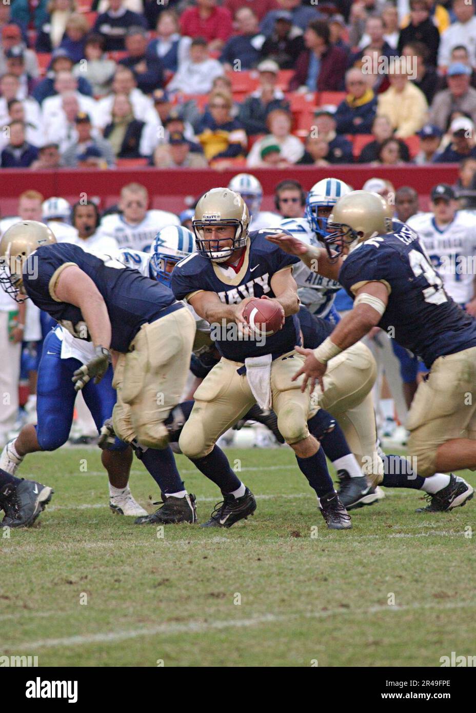 US Navy Navy quarterback Craig Candeto hands off to fullback Kyle Eckel ...
