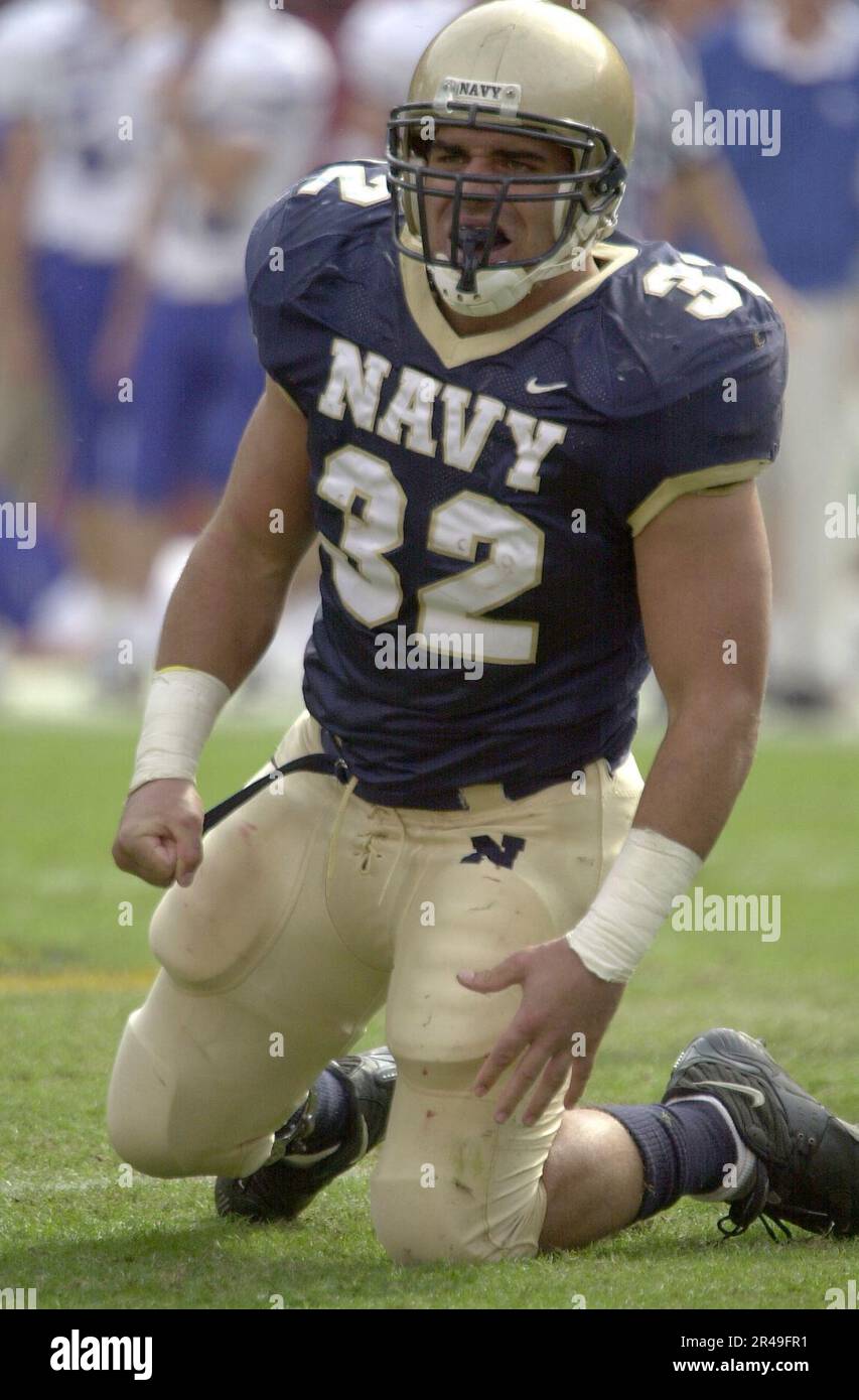 US Navy Navy fullback Kyle Eckel celebrates a rushing attempt against ...