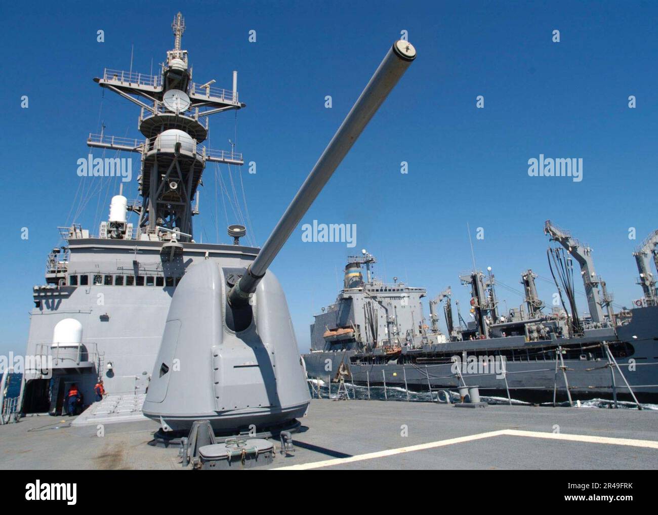 US Navy SS Fletcher (DD-992) navigates along side USNS Pecos (T-AU197 ...