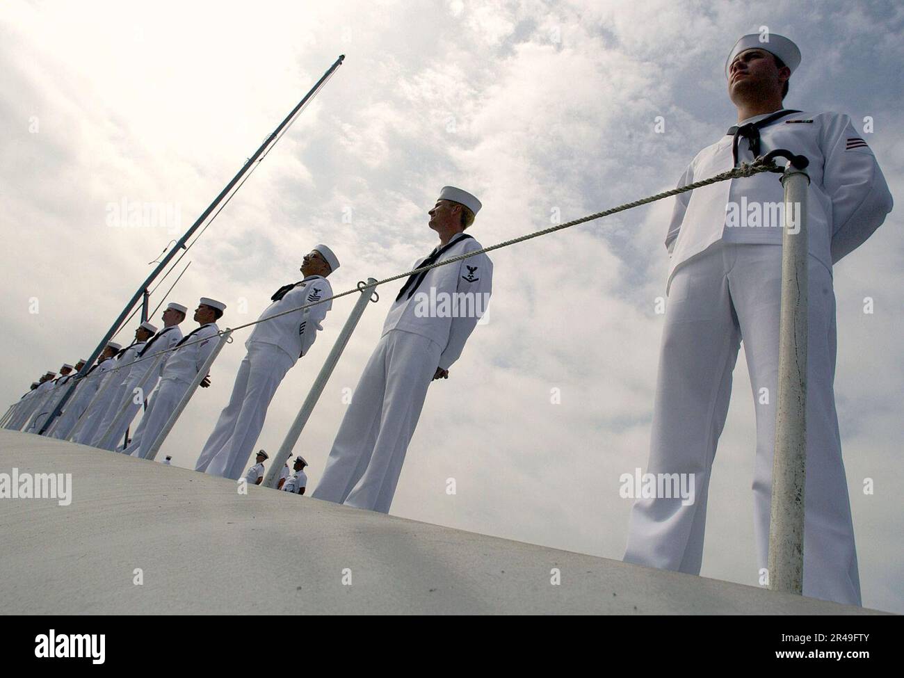 US Navy Sailors man the rails of USS John C. Stennis (CVN 74) as the ...