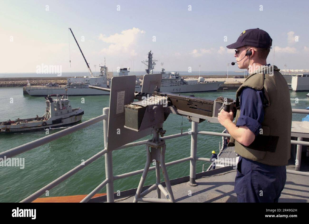 US Navy orpedoman Robert Allen mans a .50 cal. gun mount aboard the ...