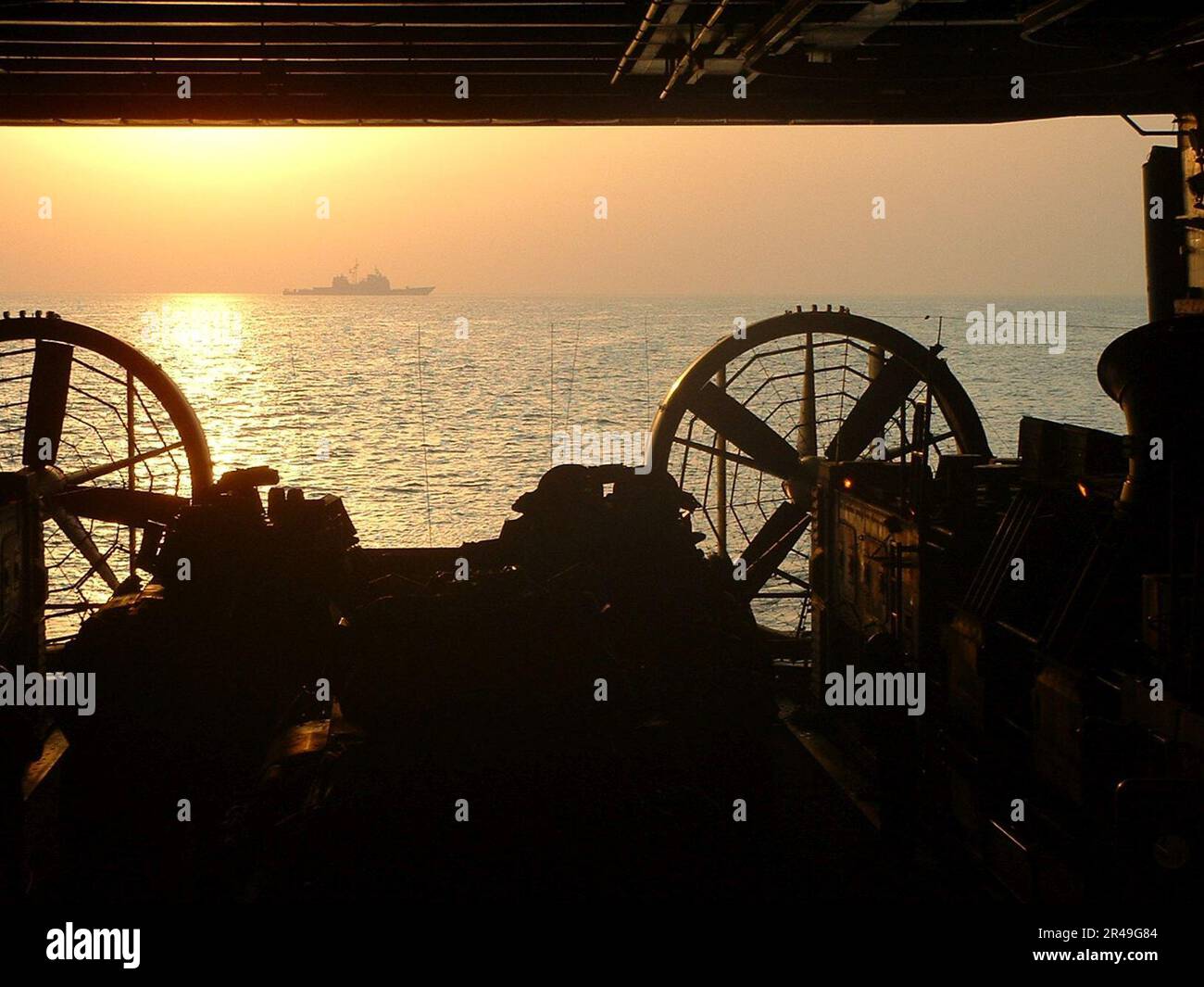 US Navy The sunrises behind a Landing Craft Air Cushion (LCAC) during ...