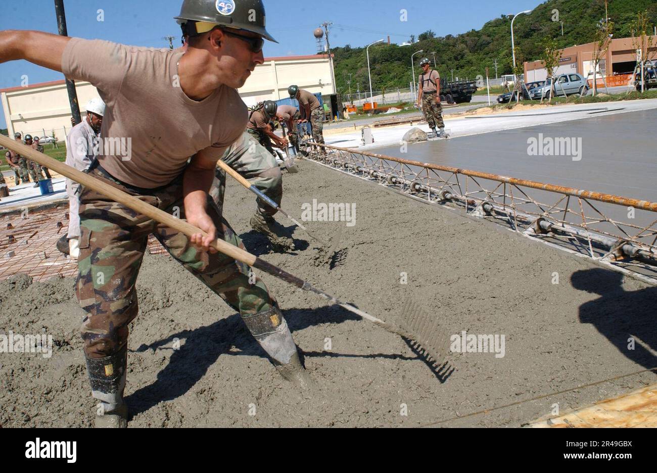 US Navy Construction Electrician Constructionman John Tingler evens out ...