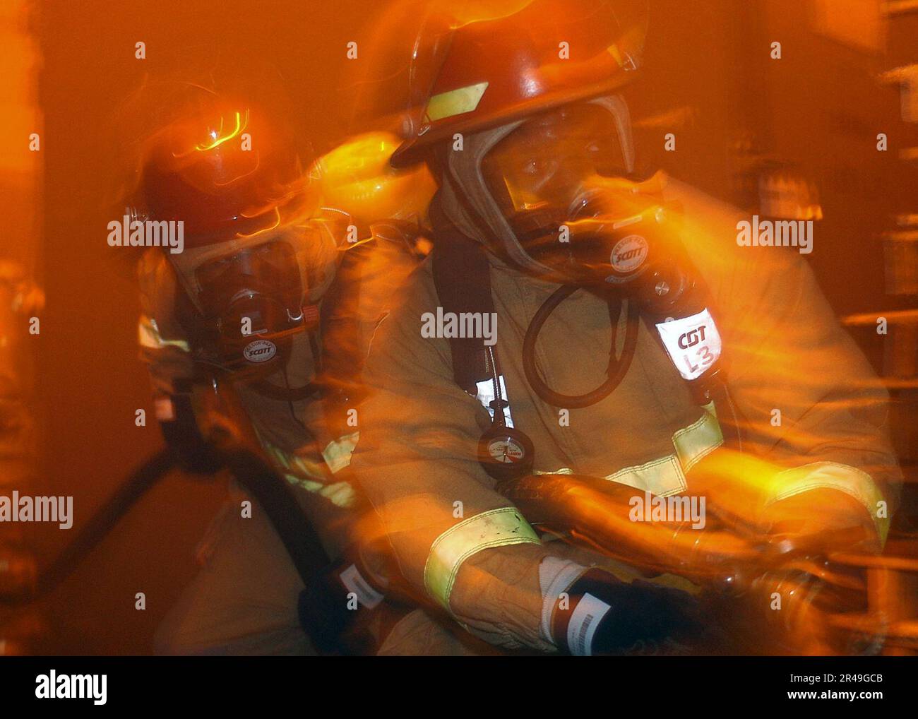 US Navy Sailors simulate fighting a fire during a General Quarters (GQ ...
