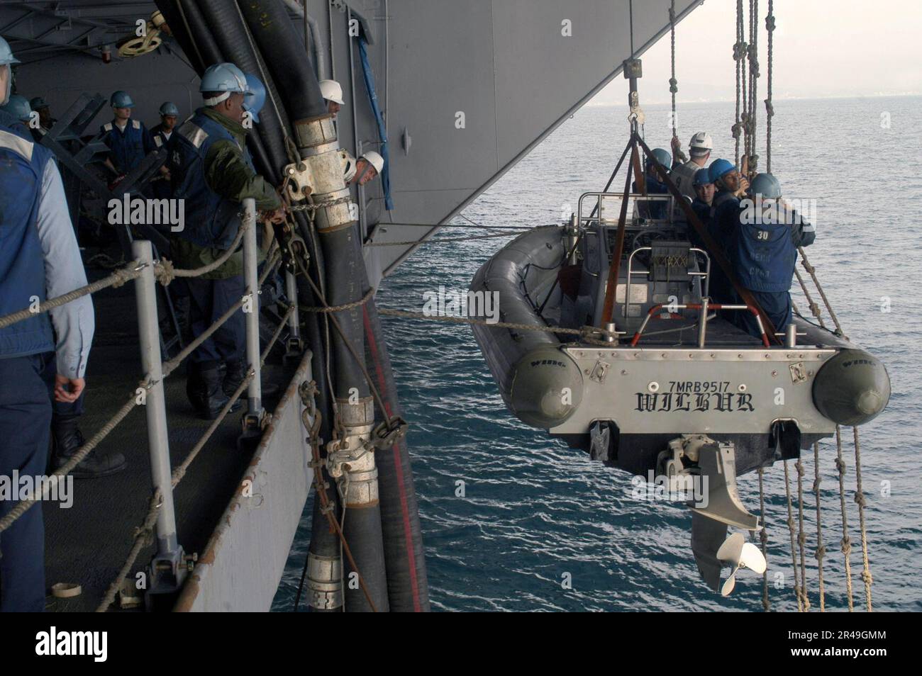 US Navy Boatswain's mates assigned to USS Kitty Hawk's (CV 63) deck ...