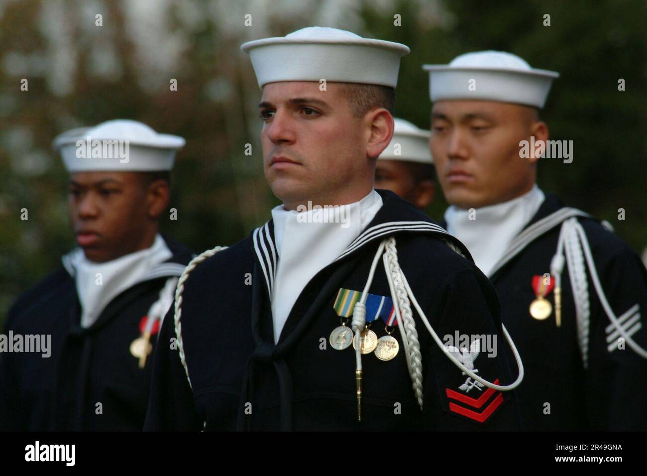 US Navy Sailors assigned to the U.S. Navy's Ceremonial Guard stand at attention during a full ...
