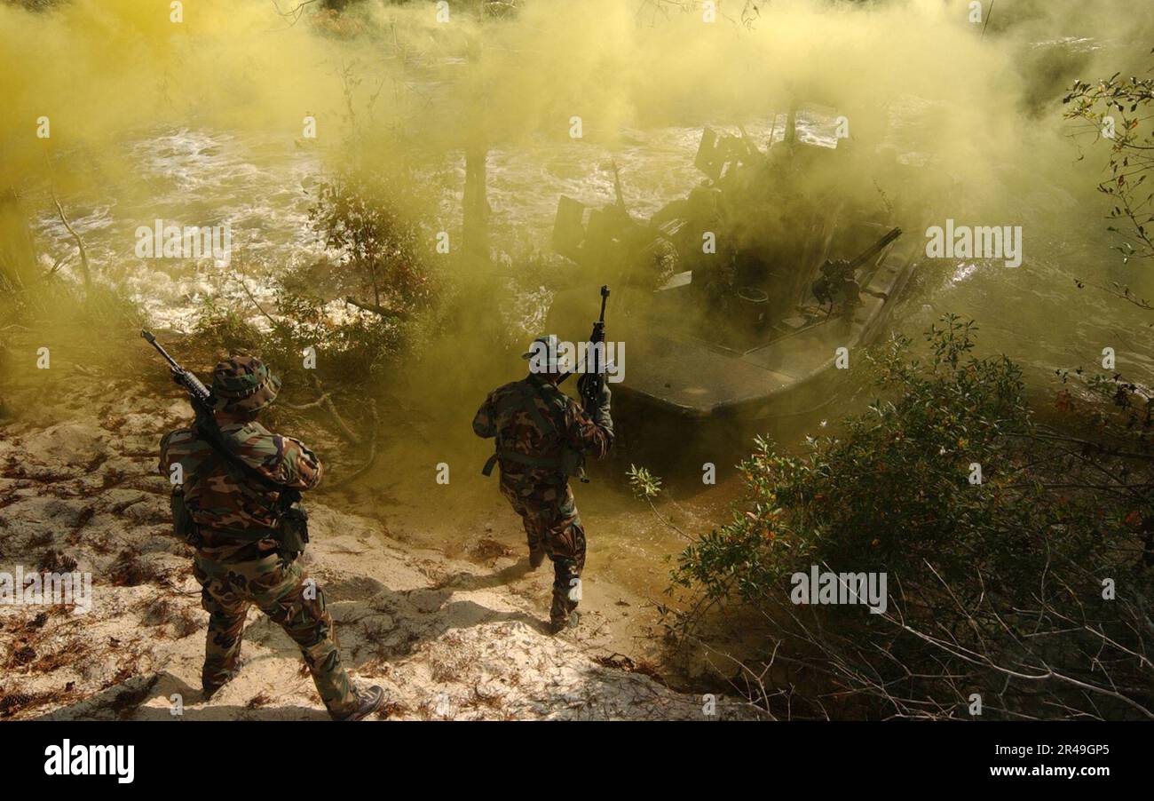 US Navy Members of Special Boat Team Two Two (SBT-22) practice narrow ...