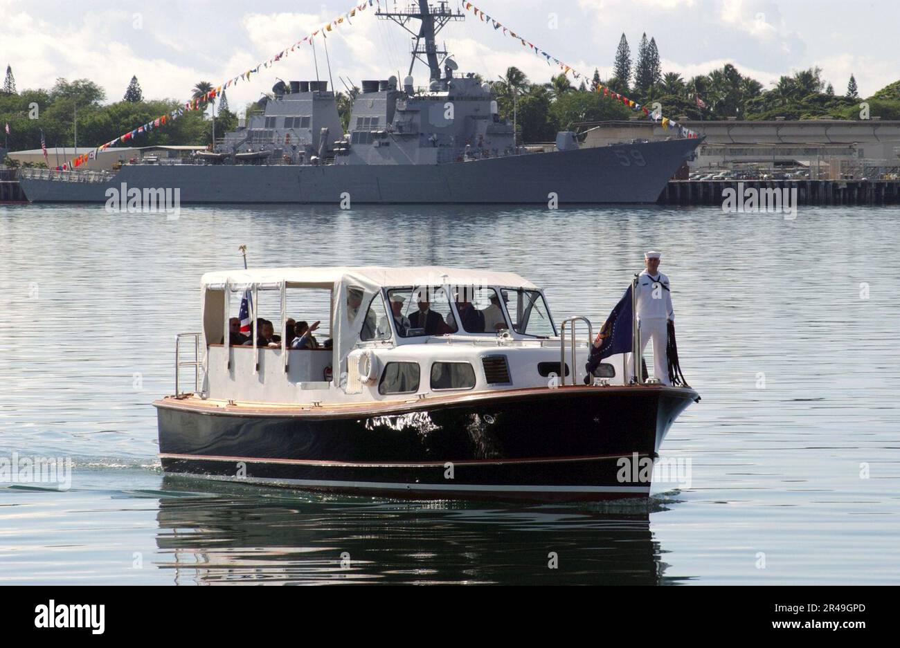 US Navy President George W. Bush and First Lady Laura Bush are escorted ...