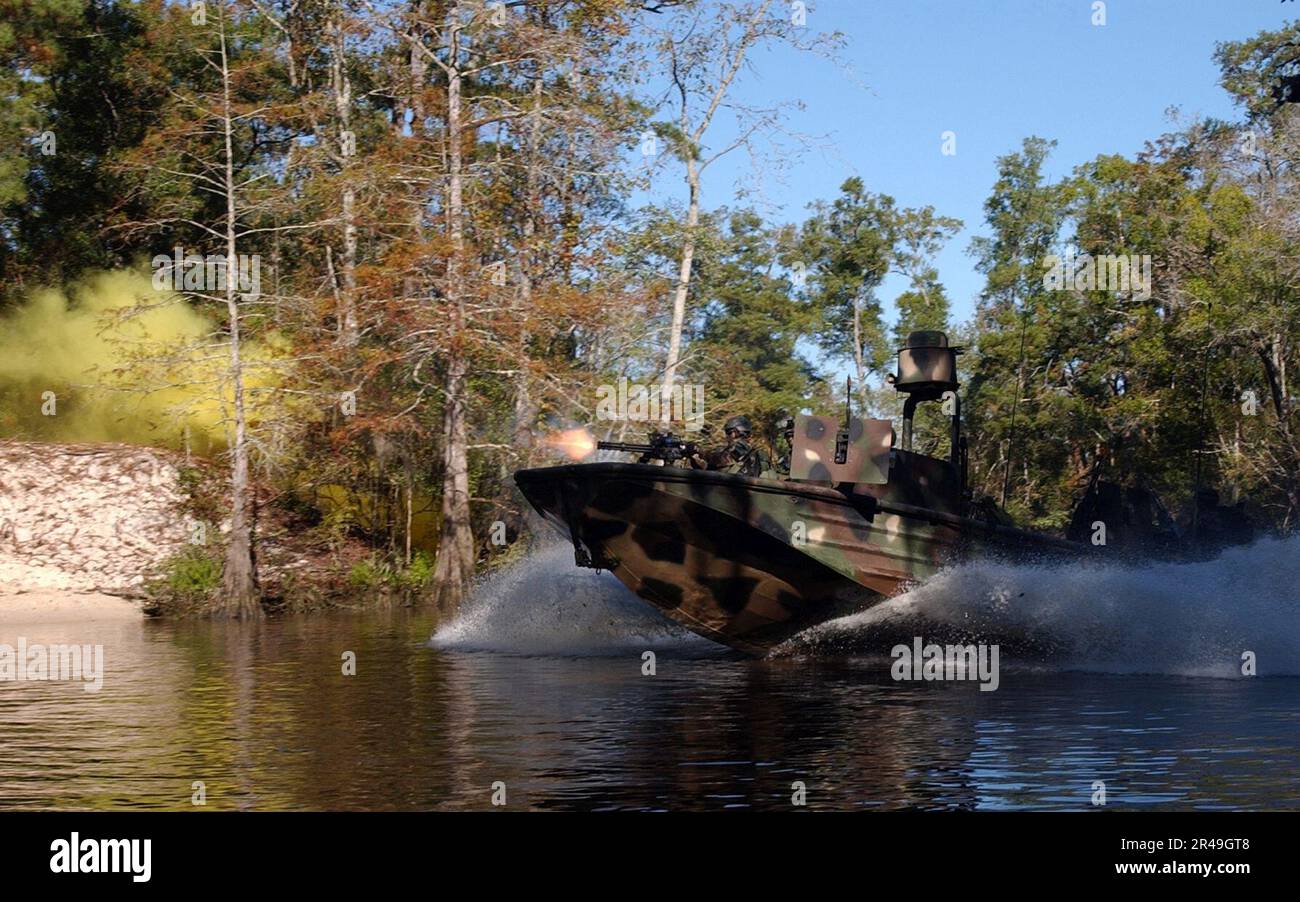 US Navy Members of Special Boat Team Two Two (SBT-22) practice narrow ...