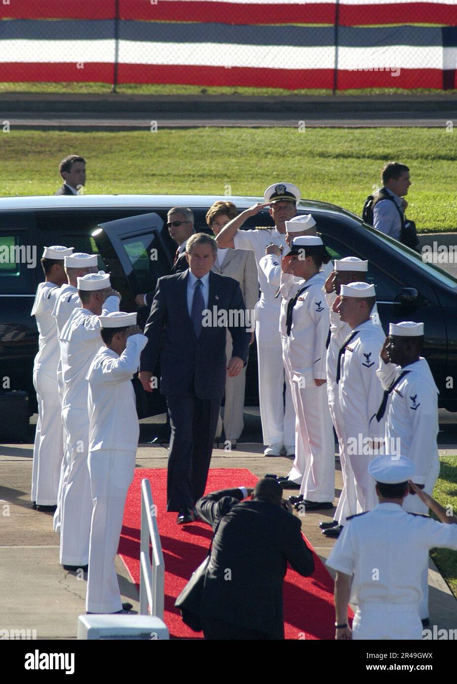 US Navy President George W. Bush accompanied by First Lady Laura Bush ...