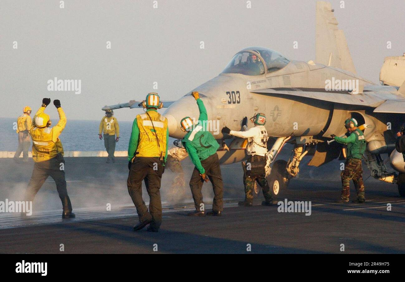 US Navy Flight deck personnel perform final safety inspections prior to ...